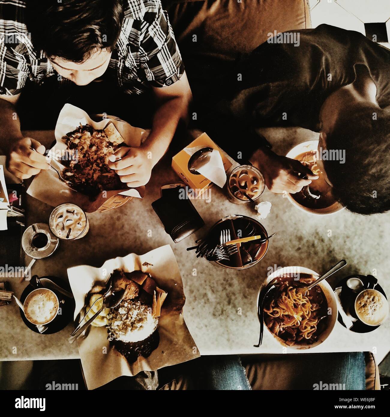 Two men eating restaurant hi-res stock photography and images - Alamy