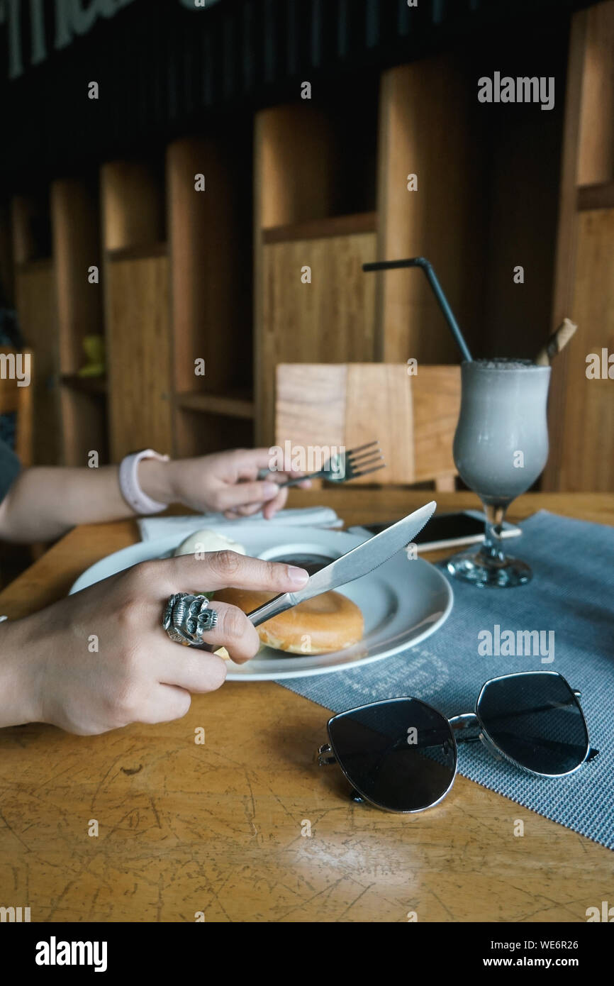 Hands holding knife fork hi-res stock photography and images - Alamy