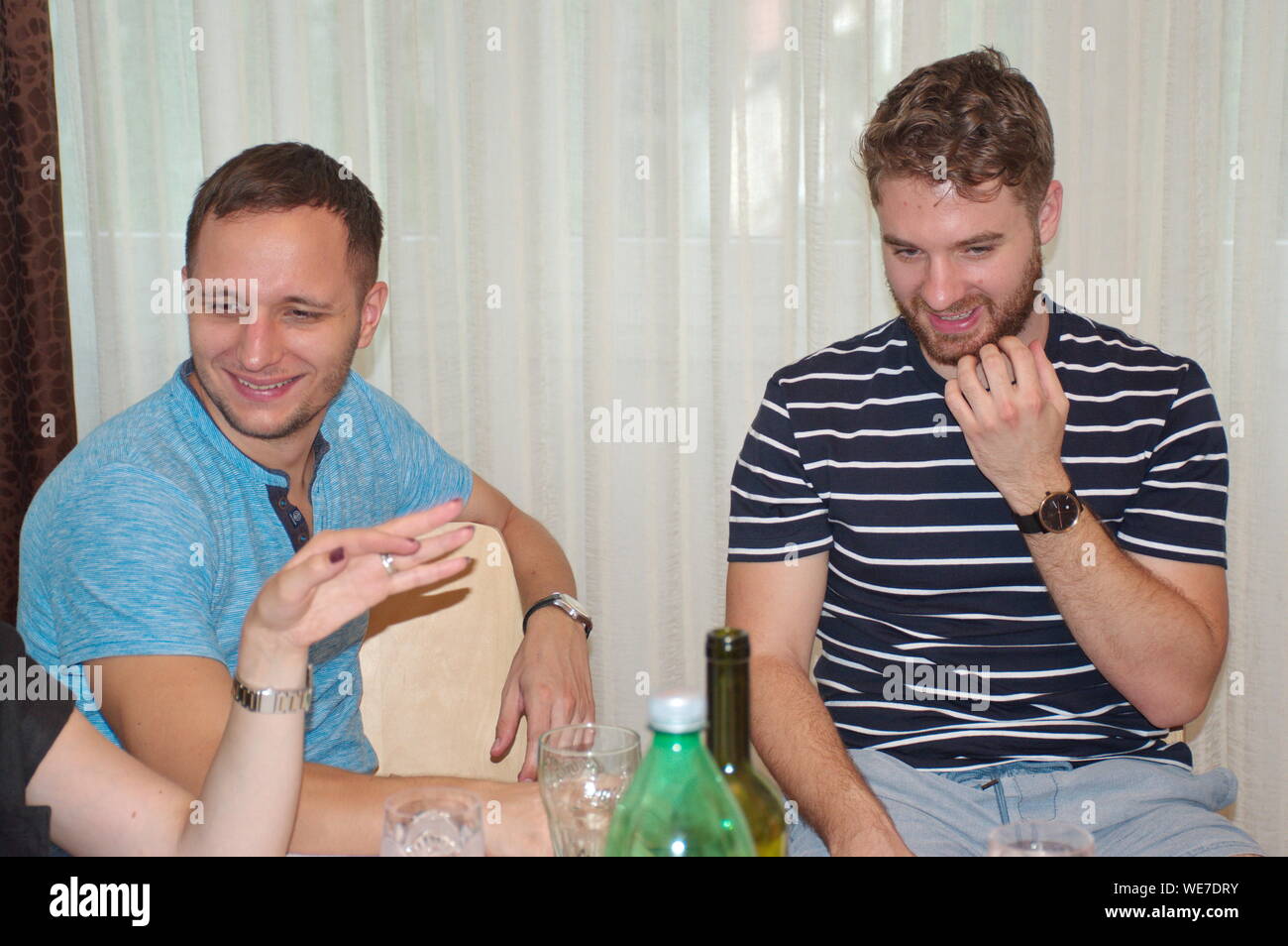 Two young men at the table at home Stock Photo - Alamy