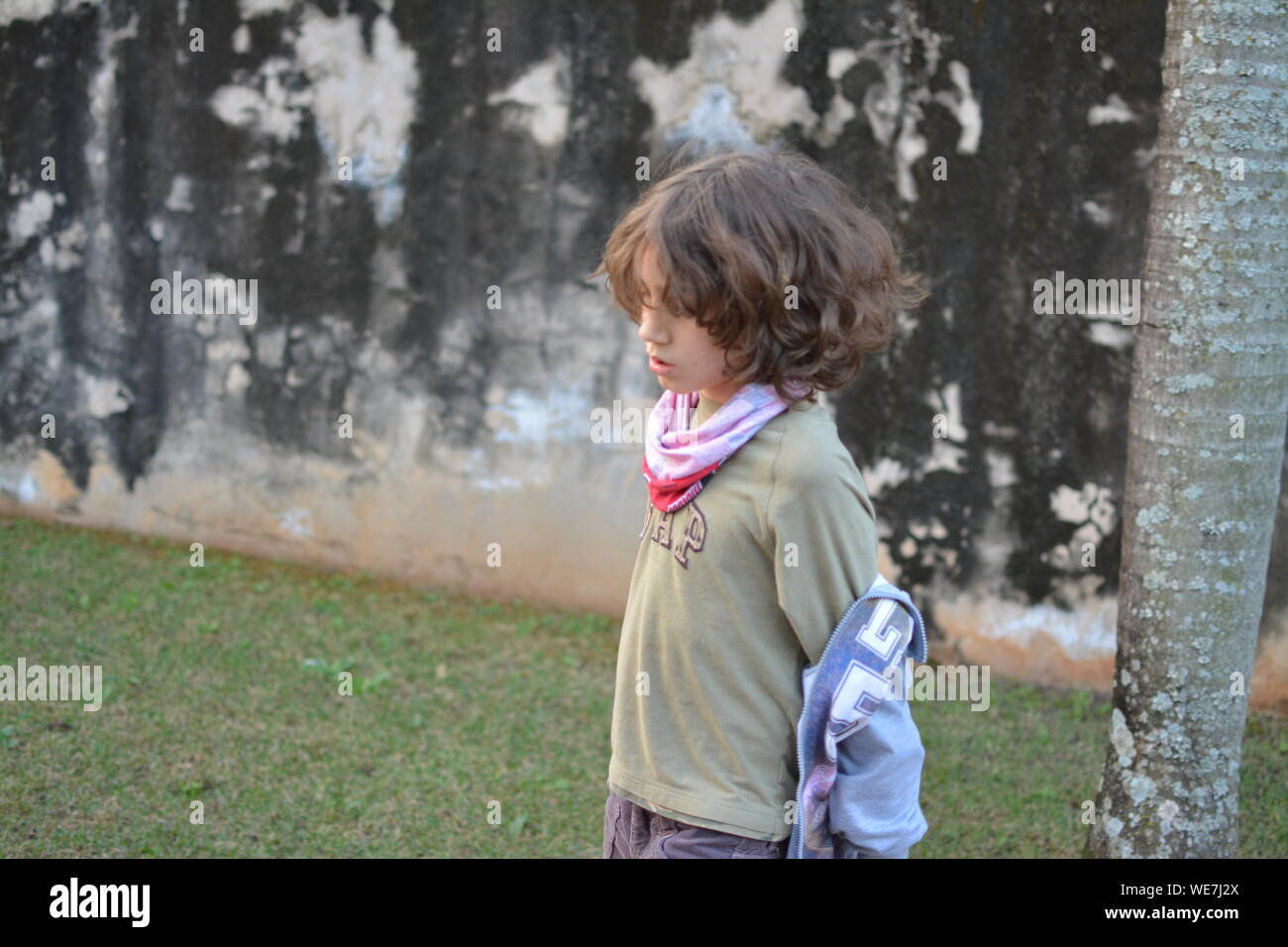 Boy removing jacket hi-res stock photography and images - Alamy