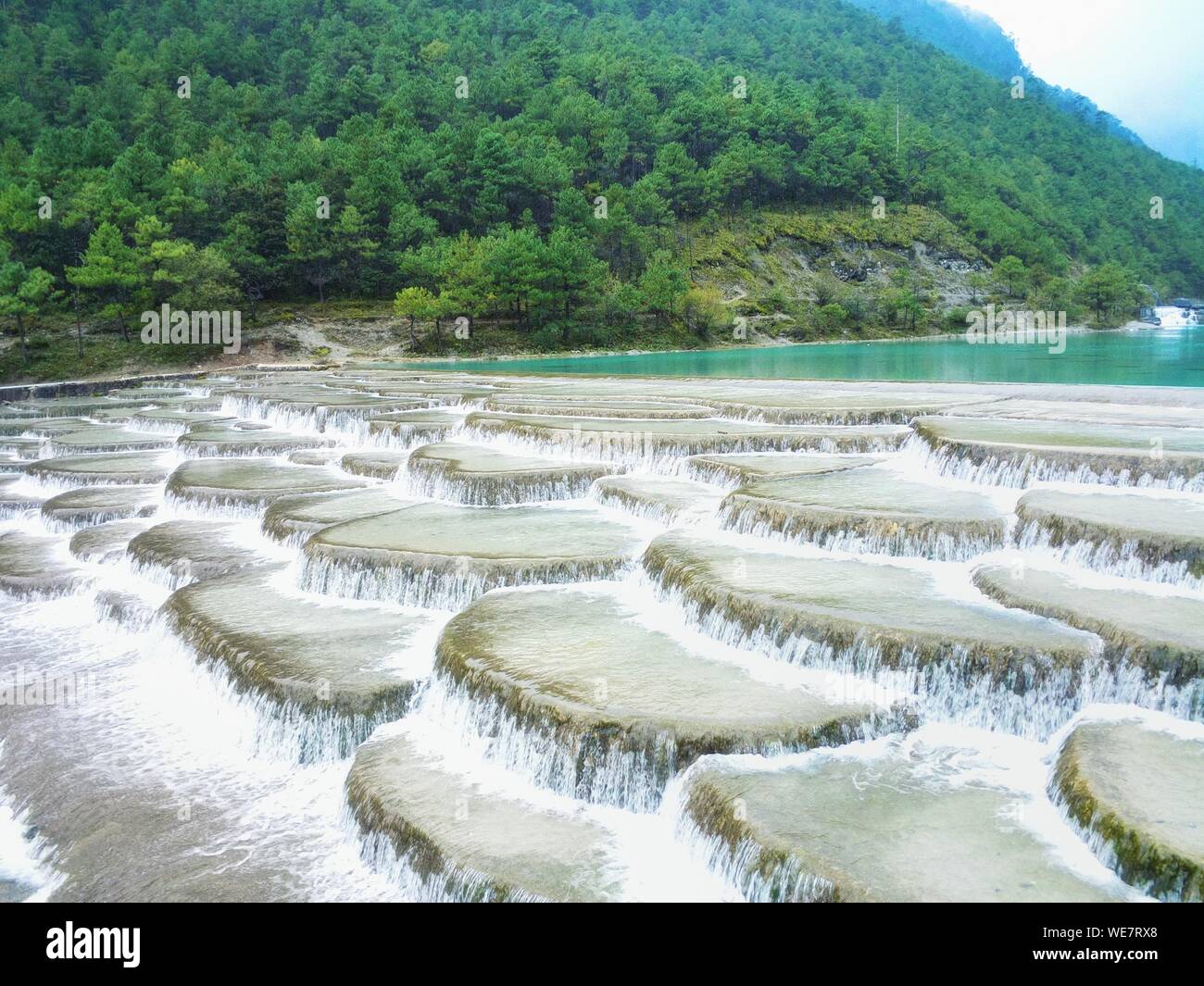 Mountain stream flowing into sea hi-res stock photography and images ...