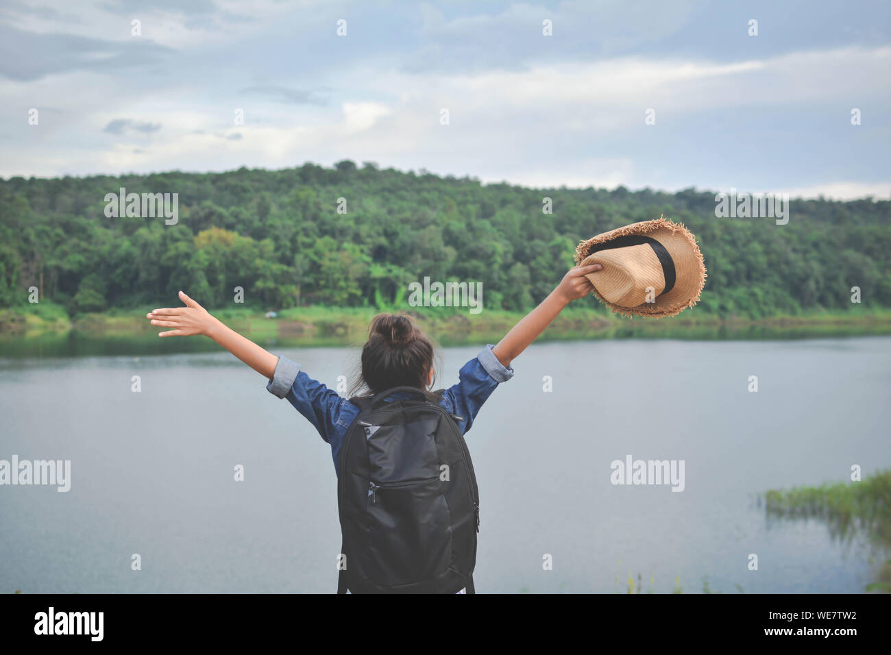Woman arms raised rear view hi-res stock photography and images - Alamy