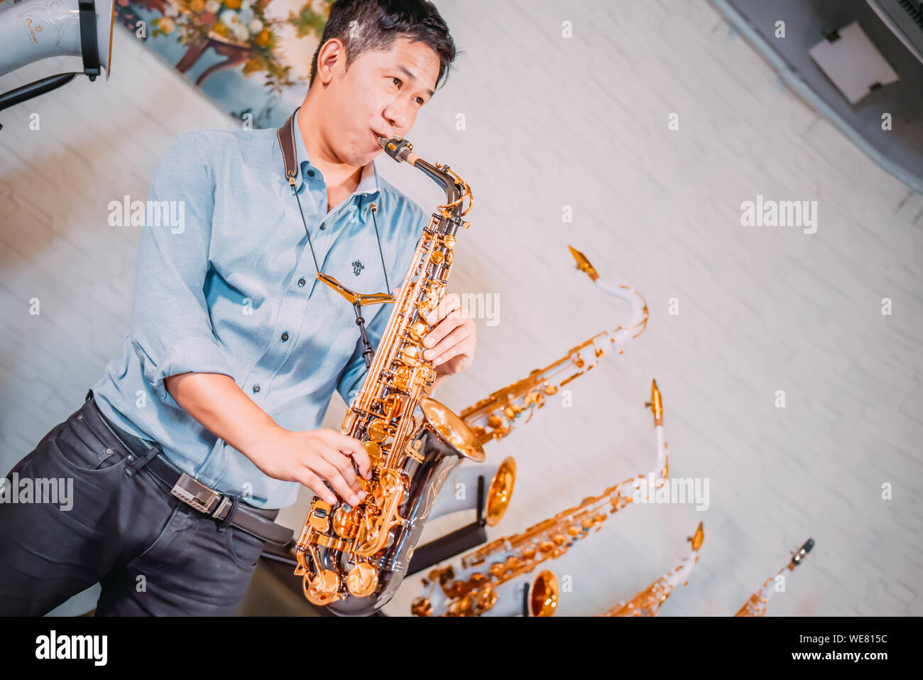 Saxophone playing man hi-res stock photography and images - Alamy