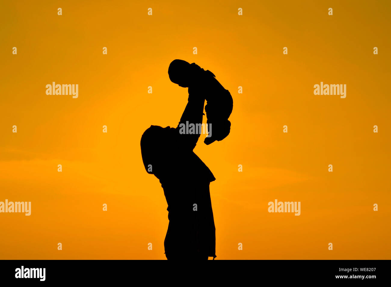Woman holding aloft hi-res stock photography and images - Alamy