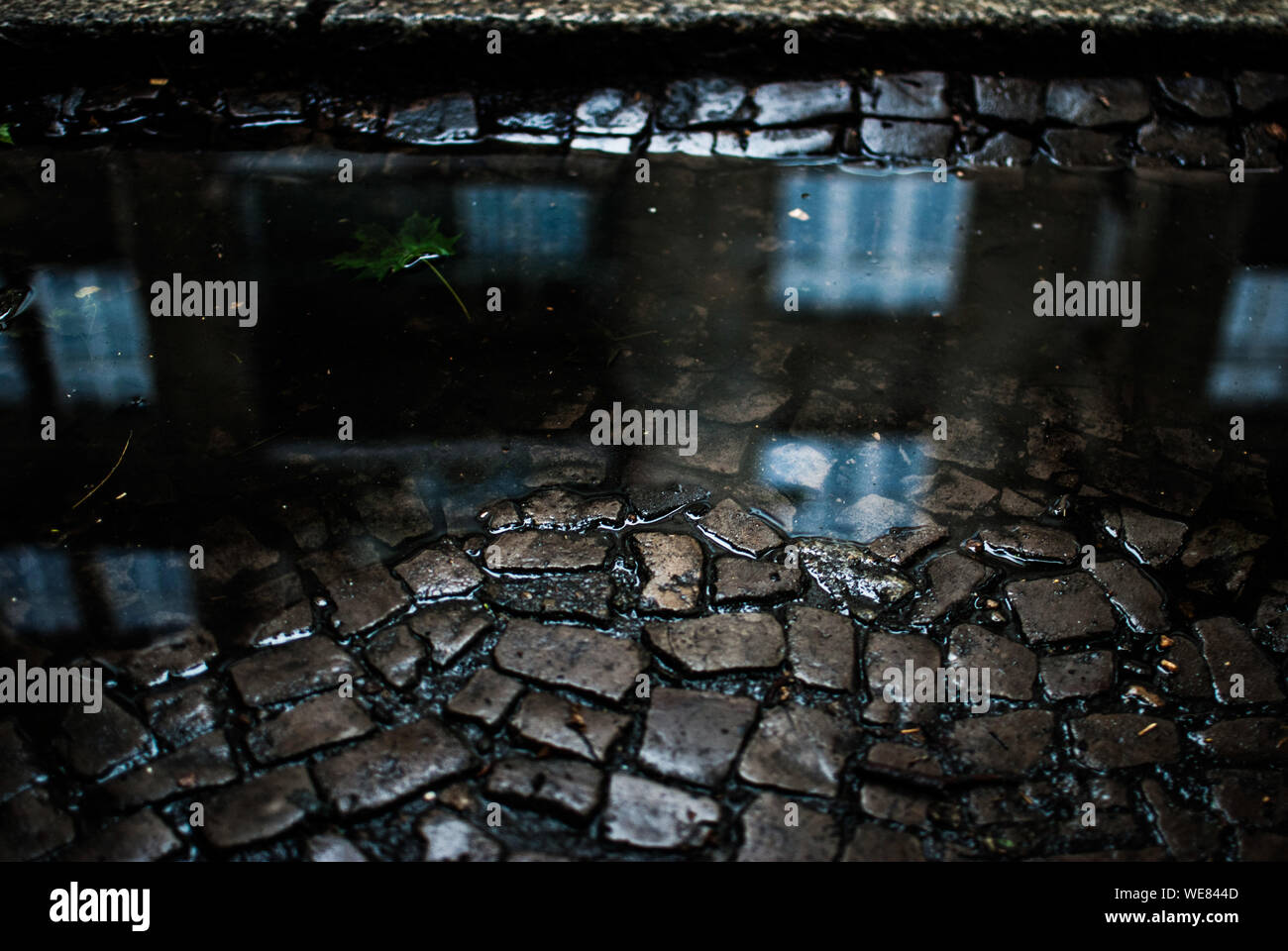Rainy cobbled street hi-res stock photography and images - Alamy