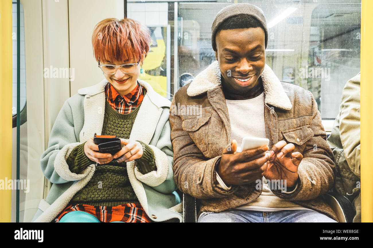 Young women holding mobile phones hi-res stock photography and images ...