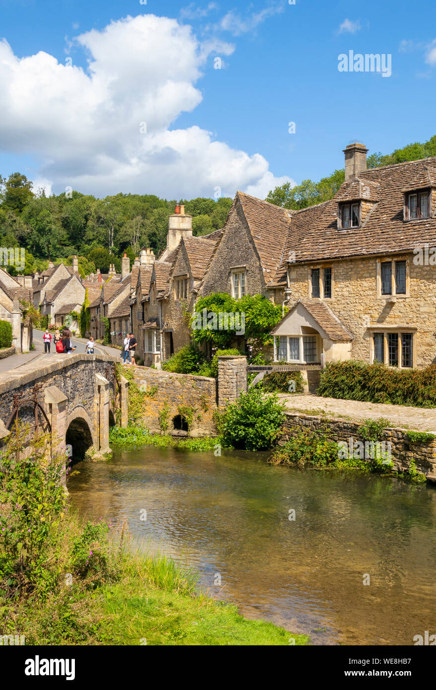 Castle Combe Water lane with bridge over the By brook on to The Street ...