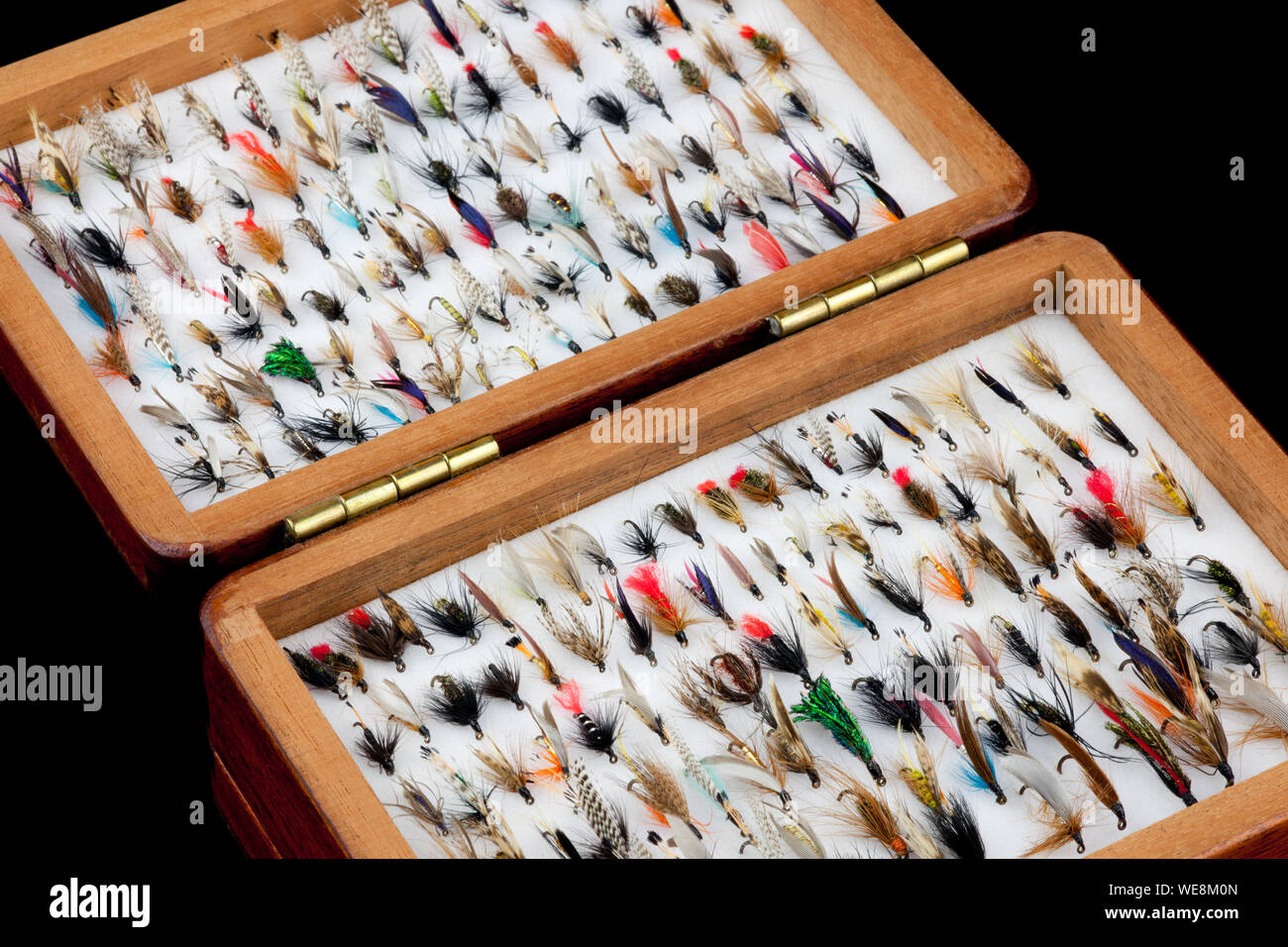 A collection of classic trout fishing flies in an old traditional ...