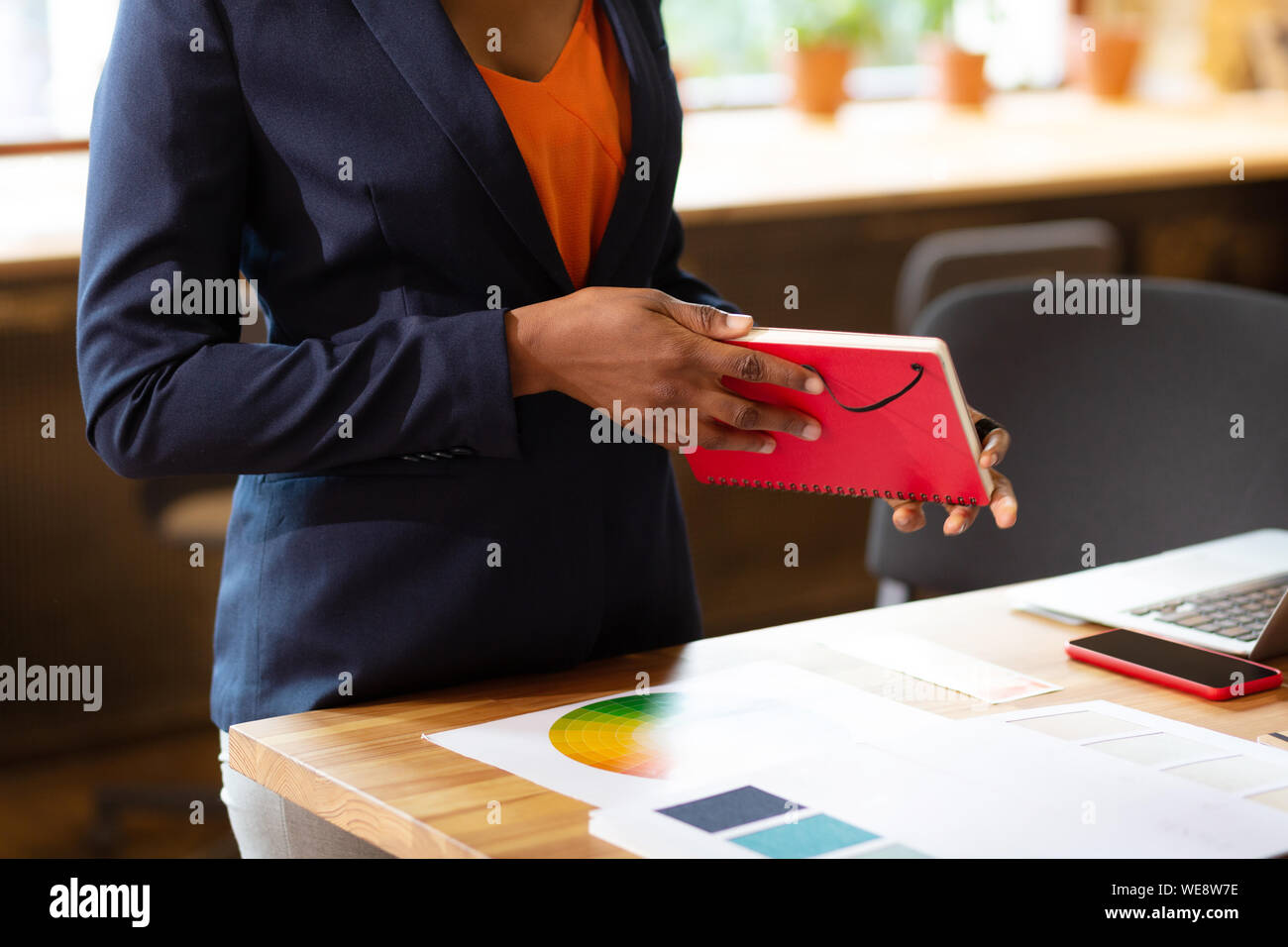 Interior designer taking notebook before making some notes Stock Photo ...