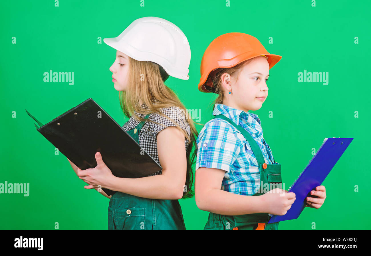 school project. small girls repairing together in workshop. Labor day ...