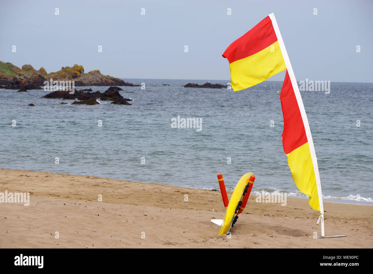 Red and yellow flags surf board hi-res stock photography and images - Alamy