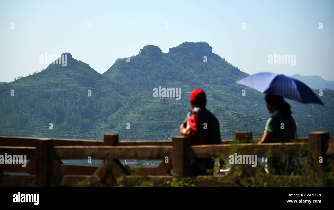 Mengyin. 30th Aug, 2019. Tourists visit the Daigu landform scenic spot ...