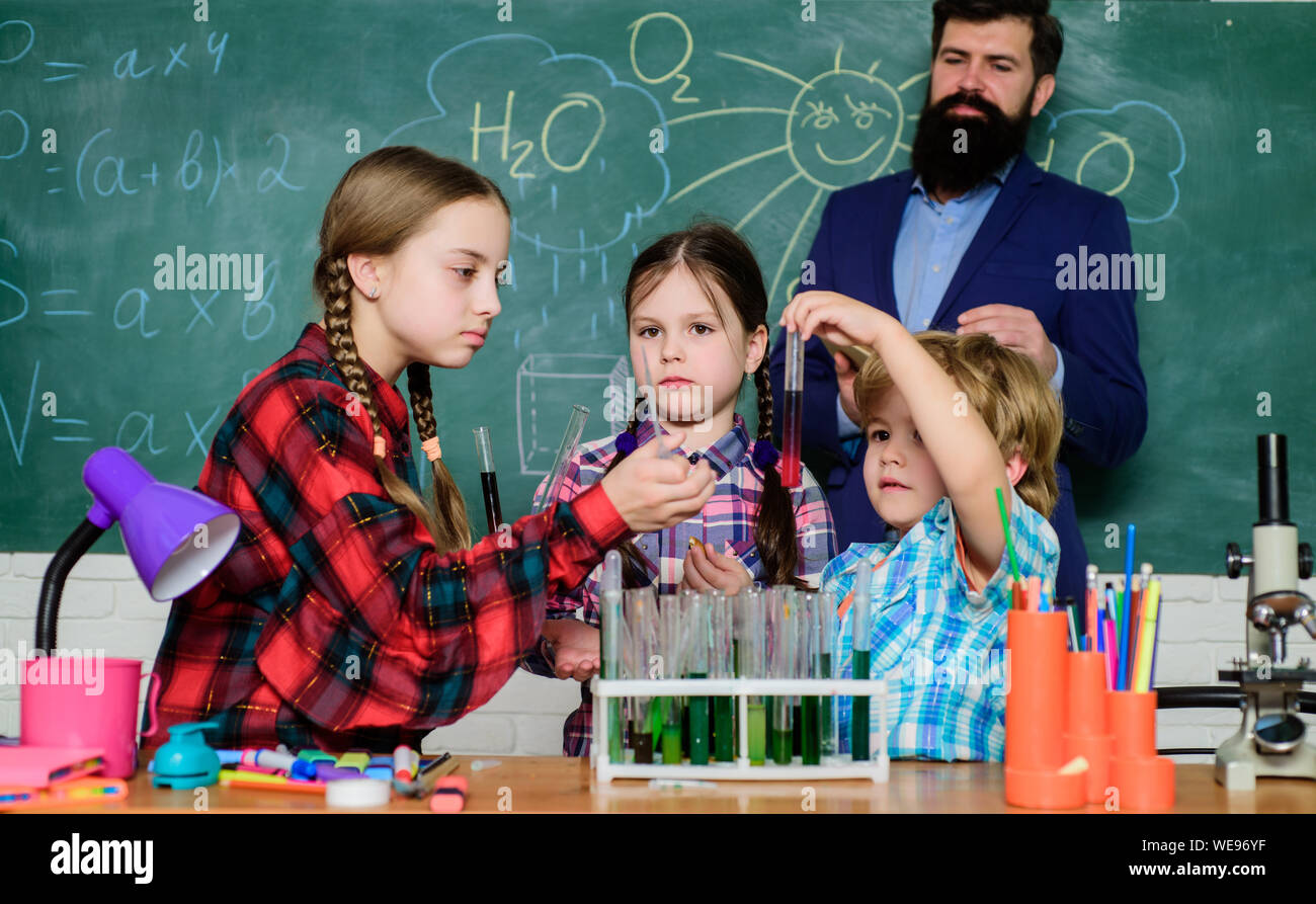 Good news. happy children teacher. doing experiments with liquids in ...
