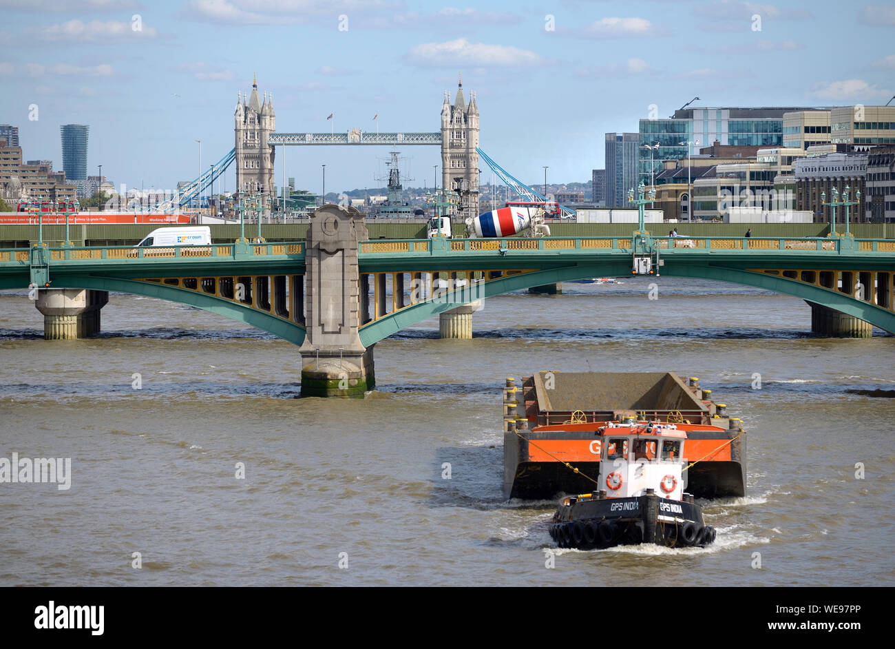 London, England, UK. Tugboat GPS India (built 1958) pulling cargo up ...