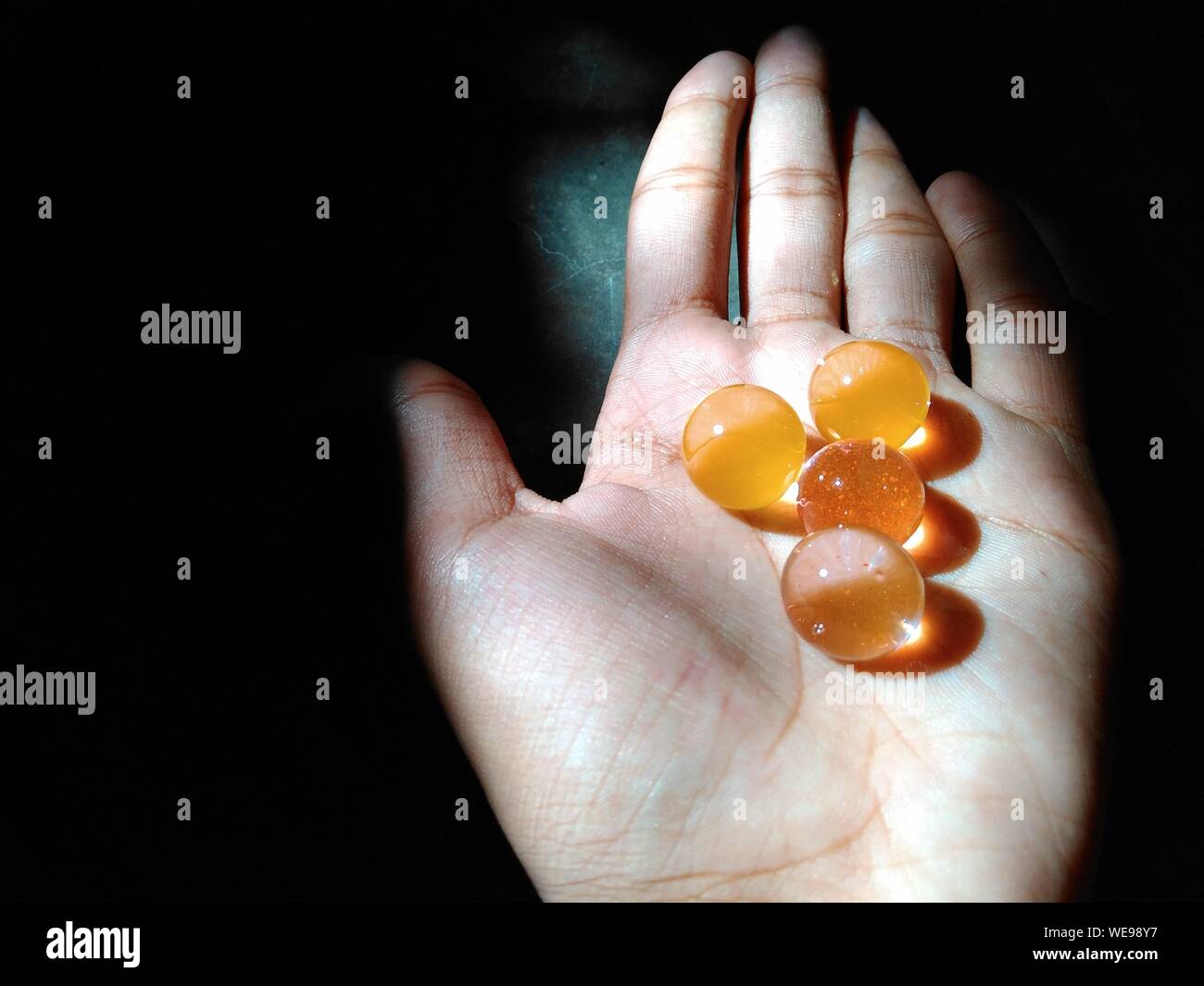 Hand Holding Marbles High Resolution Stock Photography and Images - Alamy