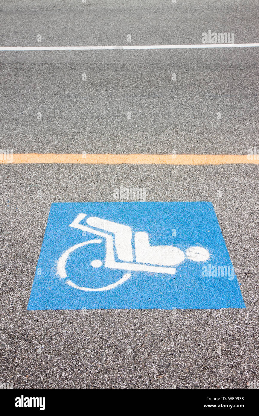 Symbol of the handicapped person painted on the asphalt Stock Photo - Alamy