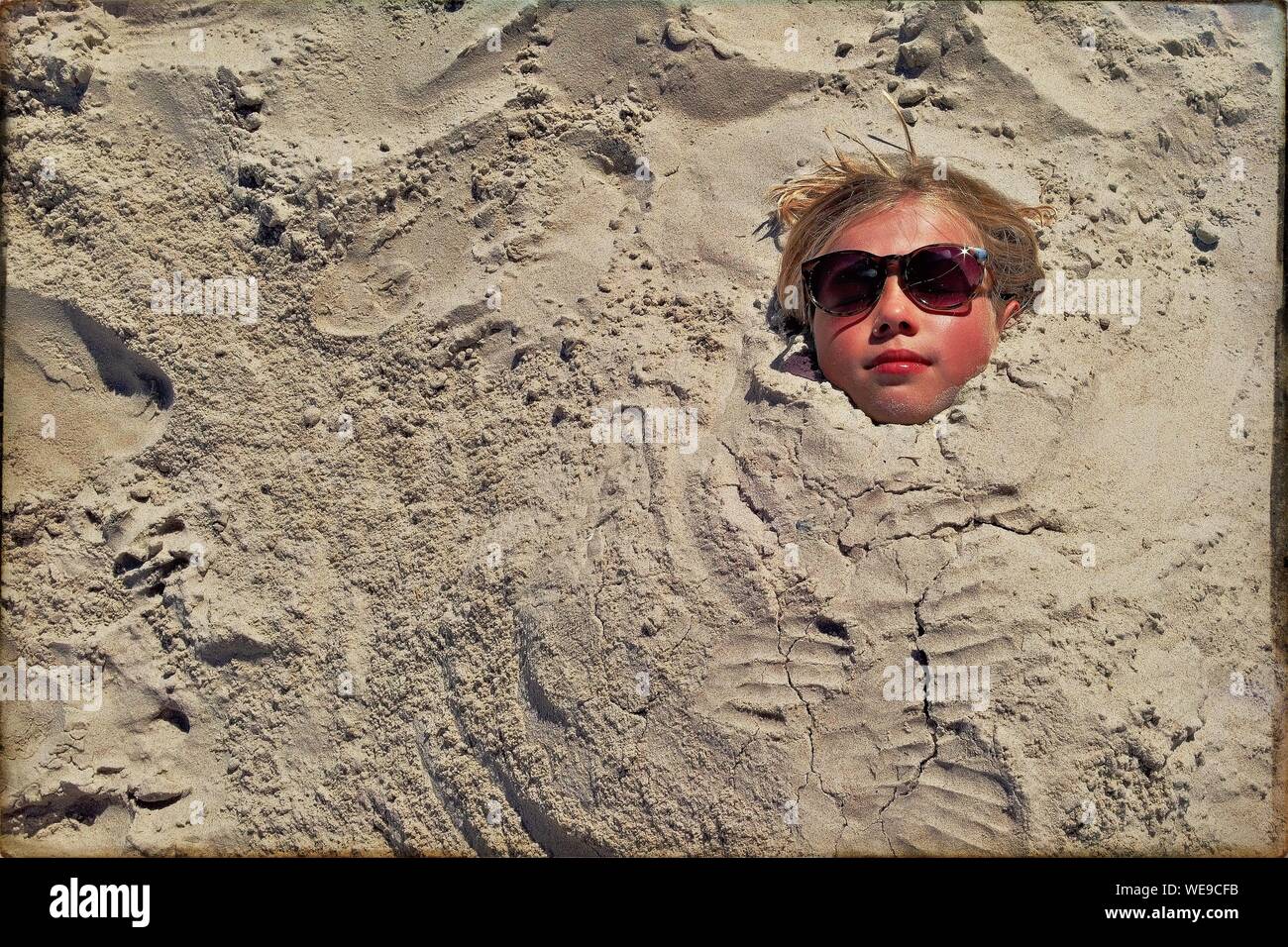 People buried in sand hi-res stock photography and images - Alamy
