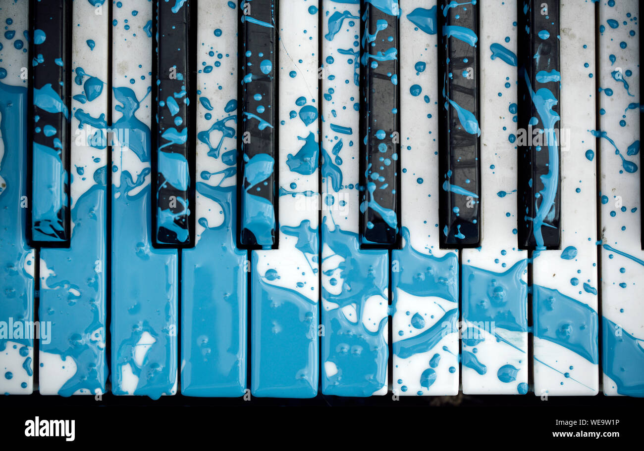 Closeup of blue painted old piano decorated. blue festive decor ...