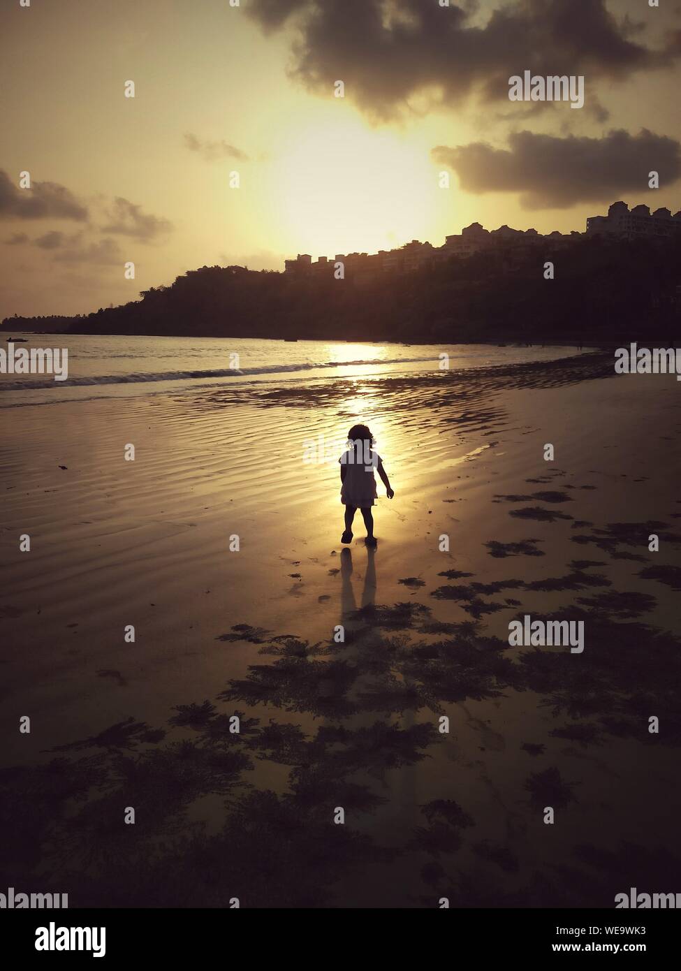 Girl walking at sunset hi-res stock photography and images - Alamy