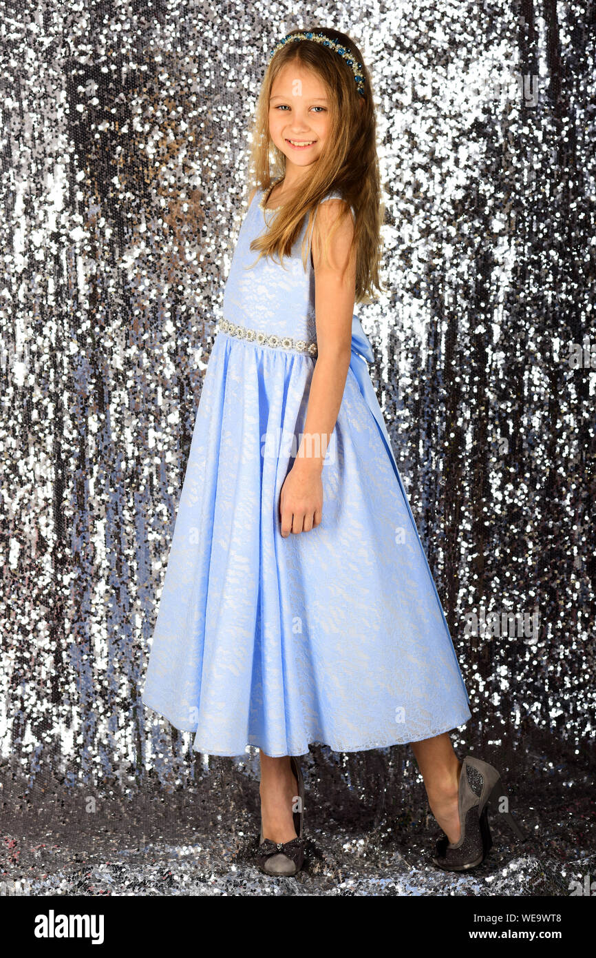 little princess in beautiful dress. little princess pose on silver ...