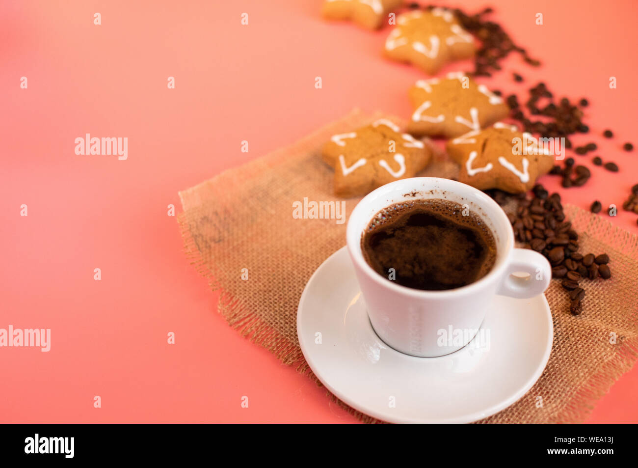 Coffee Cup gingerbread and coffee beans on pink background Stock Photo ...