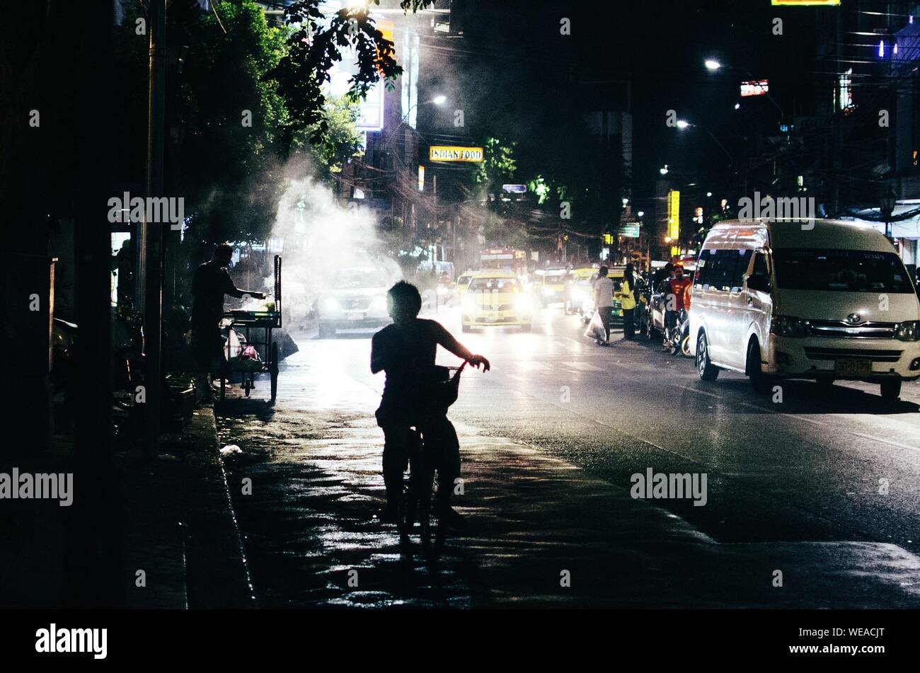 Traffic Moving On Road At Night Stock Photo - Alamy