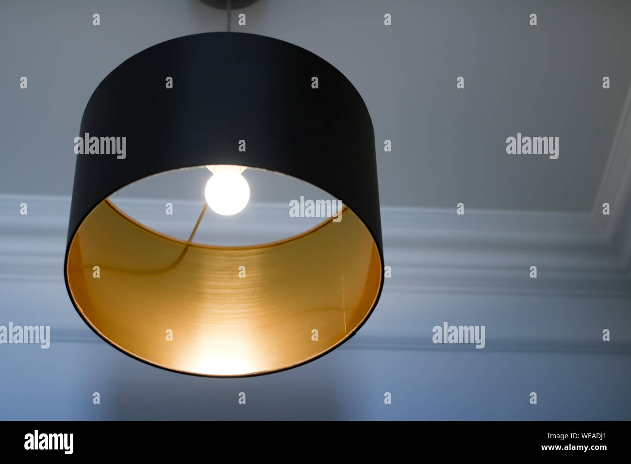 Interior design, indoor lamps and electricity concept - Golden lamp in ...