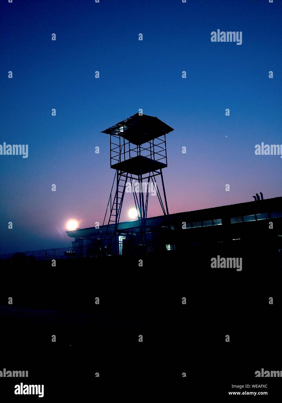 Illuminated lookout tower night sky hi-res stock photography and images ...
