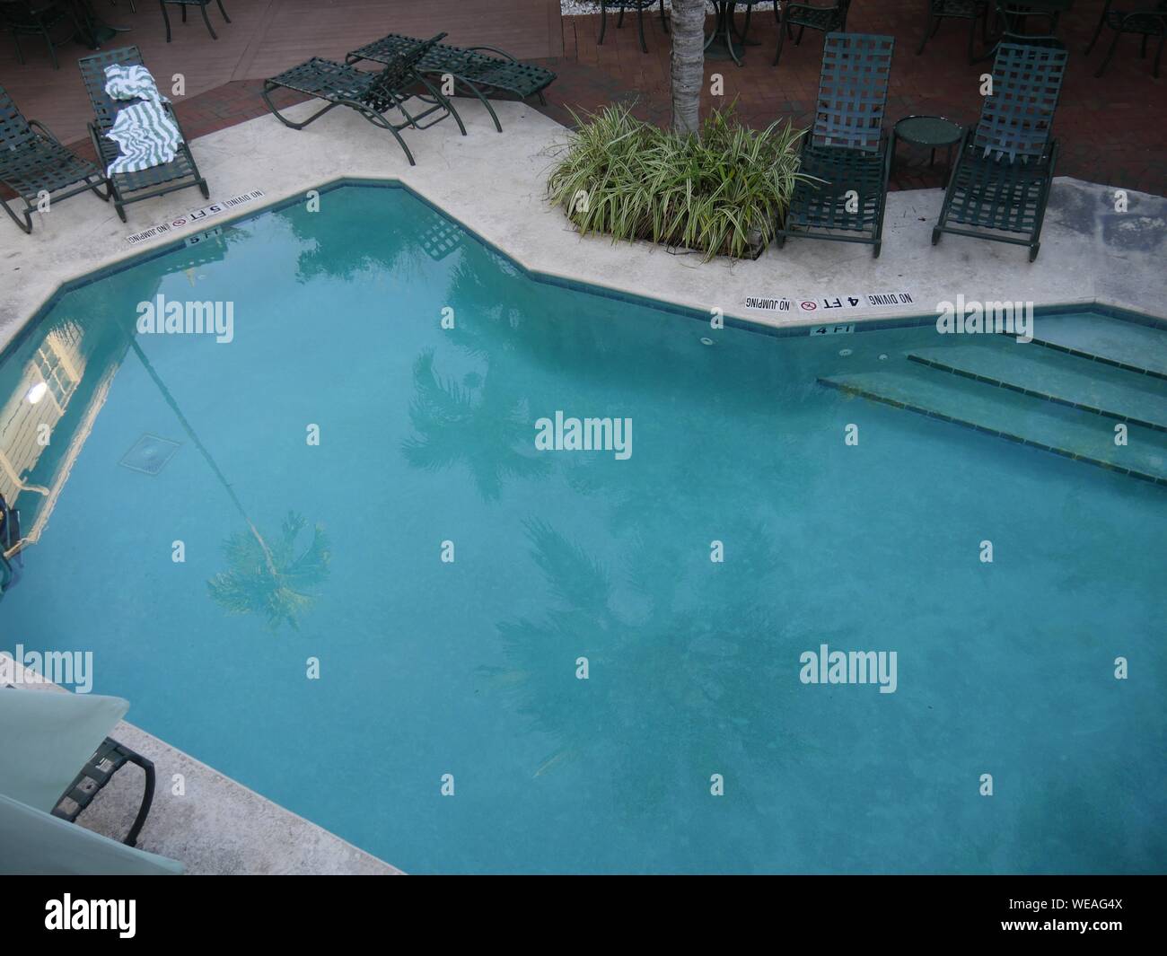Close up downward shot of a small backyard pool Stock Photo - Alamy