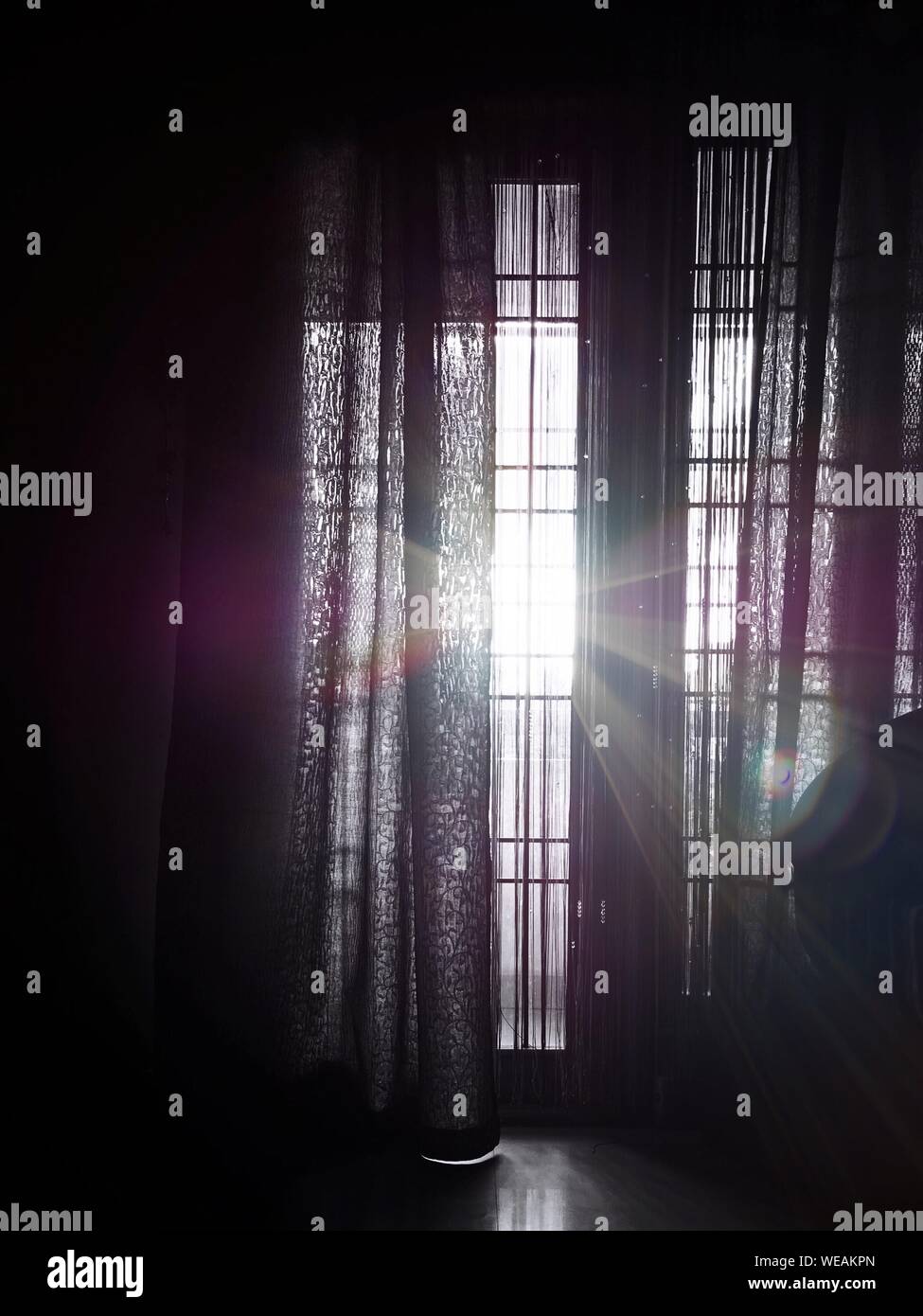 Sunbeam Shining Through Closed Door At Home Stock Photo - Alamy