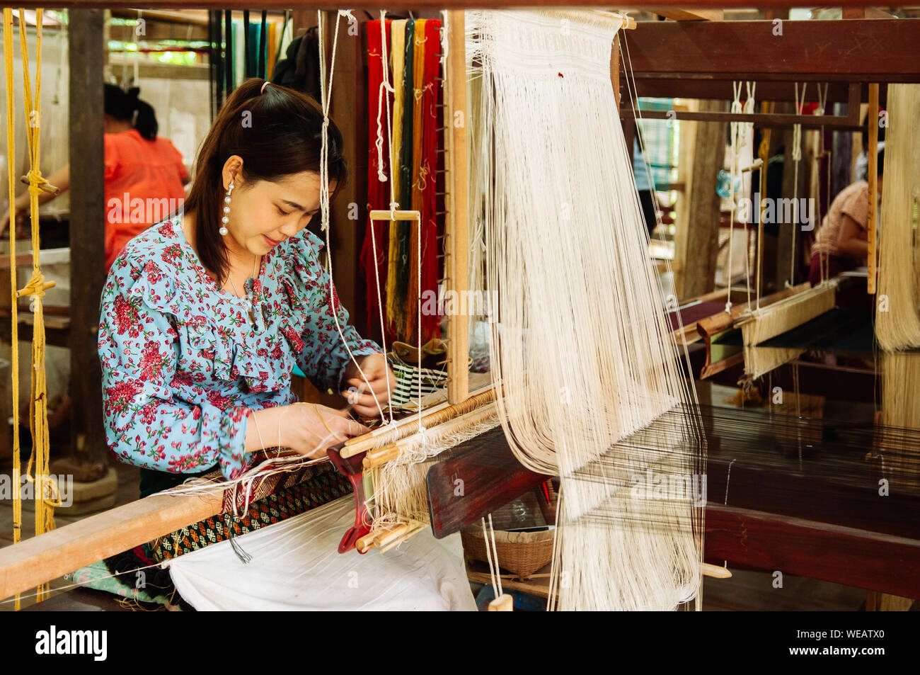 APR 4, 2018 Luang Prabang, Laos - Young woman working on Vintage Laos ...