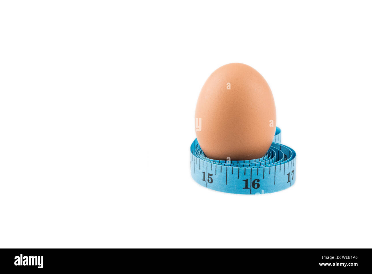 Egg and measuring tape Cut Out Stock Images & Pictures - Alamy