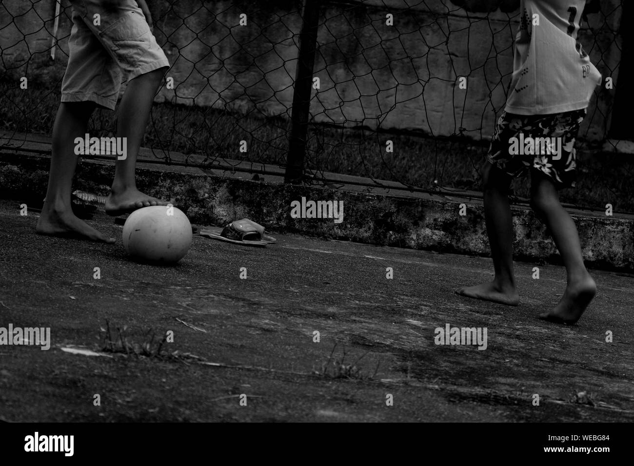 Children playing soccer ball Black and White Stock Photos & Images - Alamy