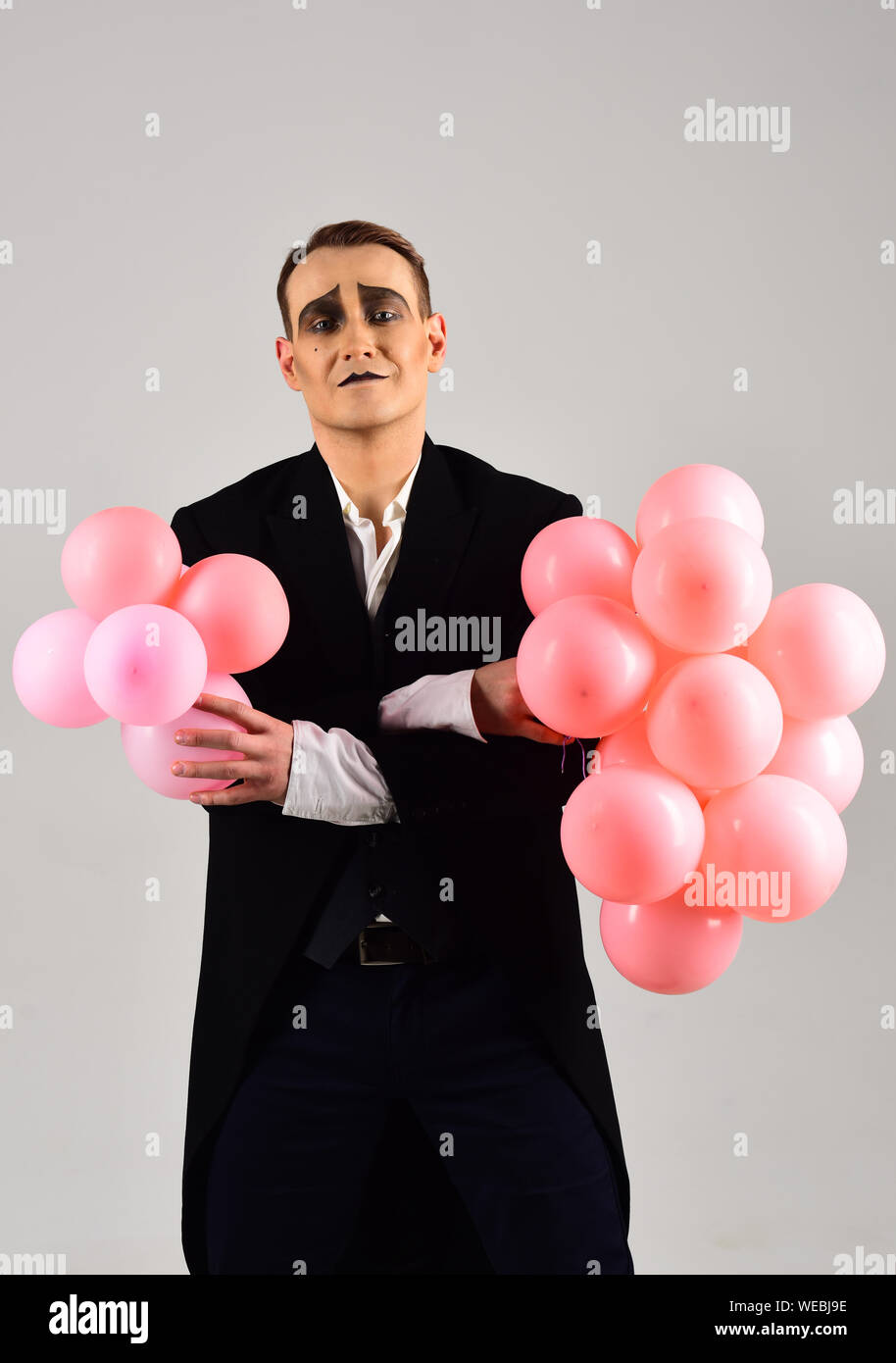 A joy that never ends. Balloon artist. Mime man with party balloons ...