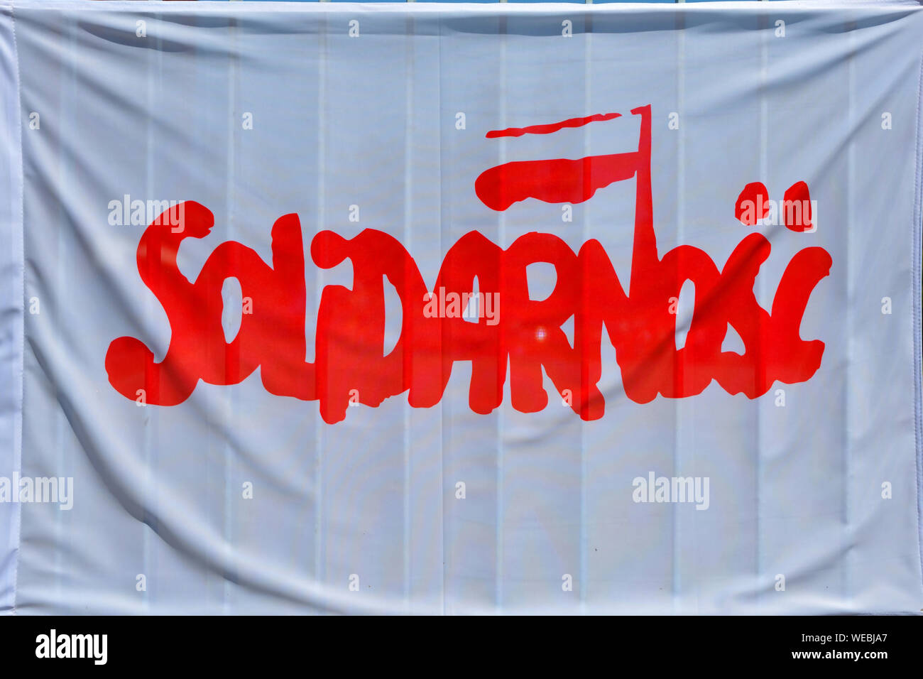 Flag of the Polish trade union Solidarnosc at the main entrance to the ...