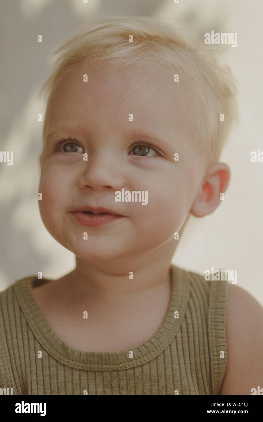 As pure as an angel. Happy baby. Little child with adorable smile. Baby ...