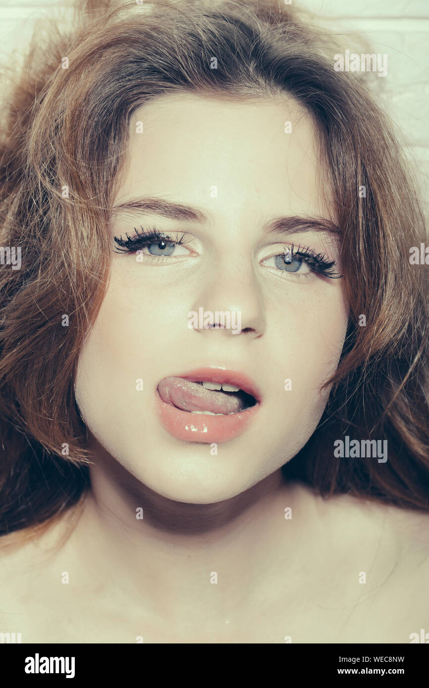 Makeup concept. Woman with makeup show tongue. Makeup model with ...