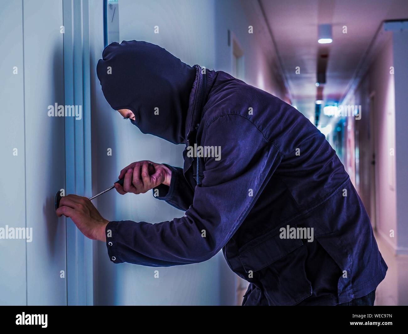 Man breaking door hi-res stock photography and images - Alamy