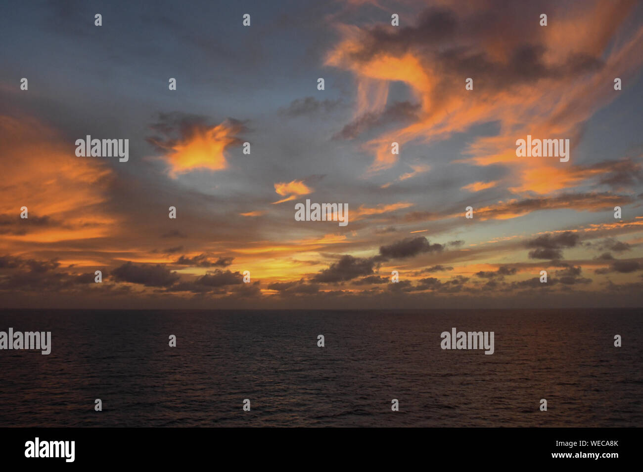 Dramatic sunset with clouds and sun rays over Caribbean sea - colorful ...