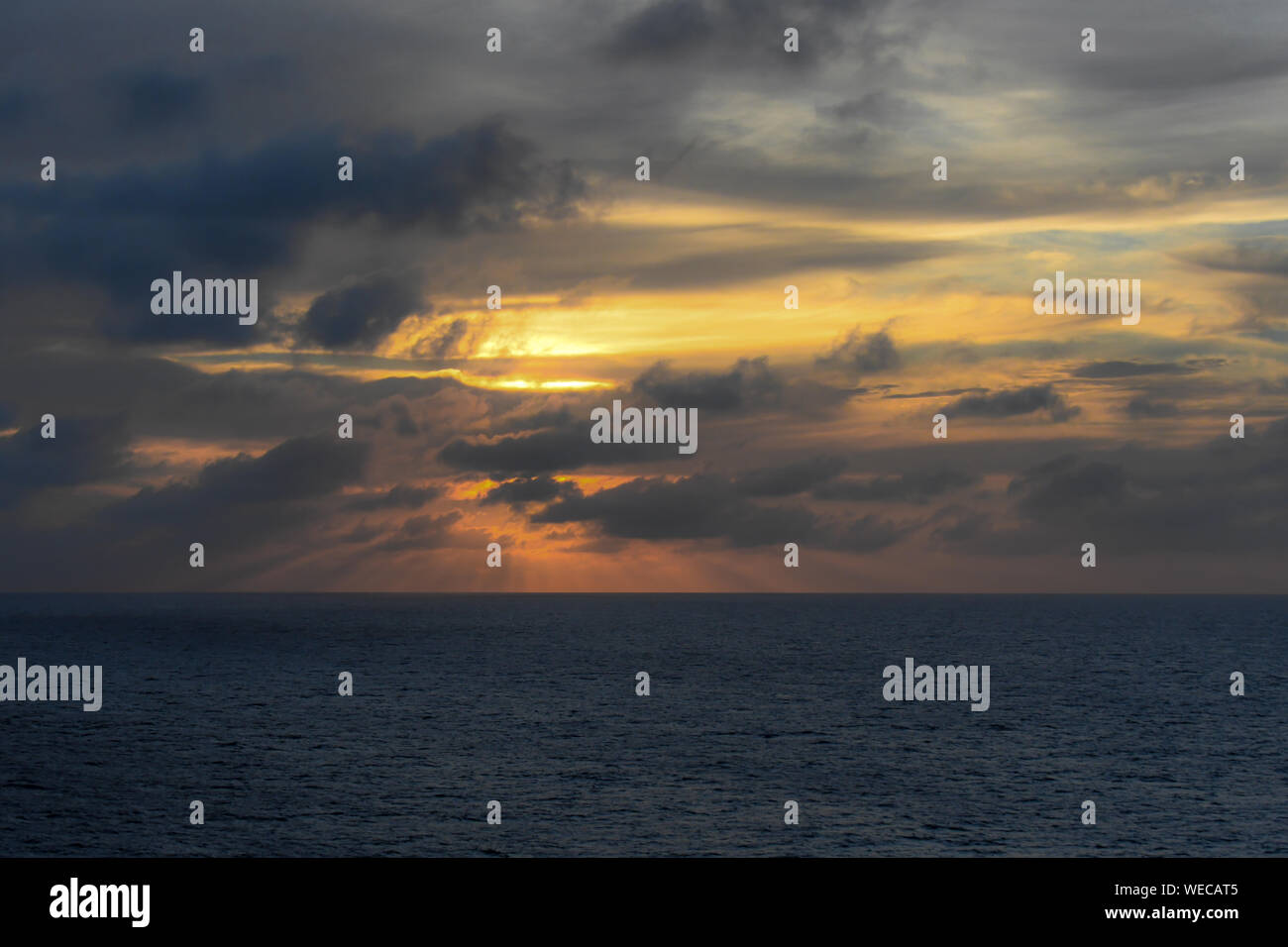 Dramatic sunset with clouds and sun rays over Caribbean sea - colorful ...