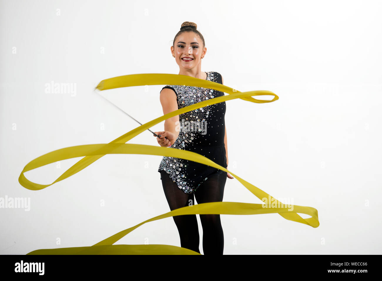 Woman train acrobatics with ribbon. Sport success and health. Workout ...