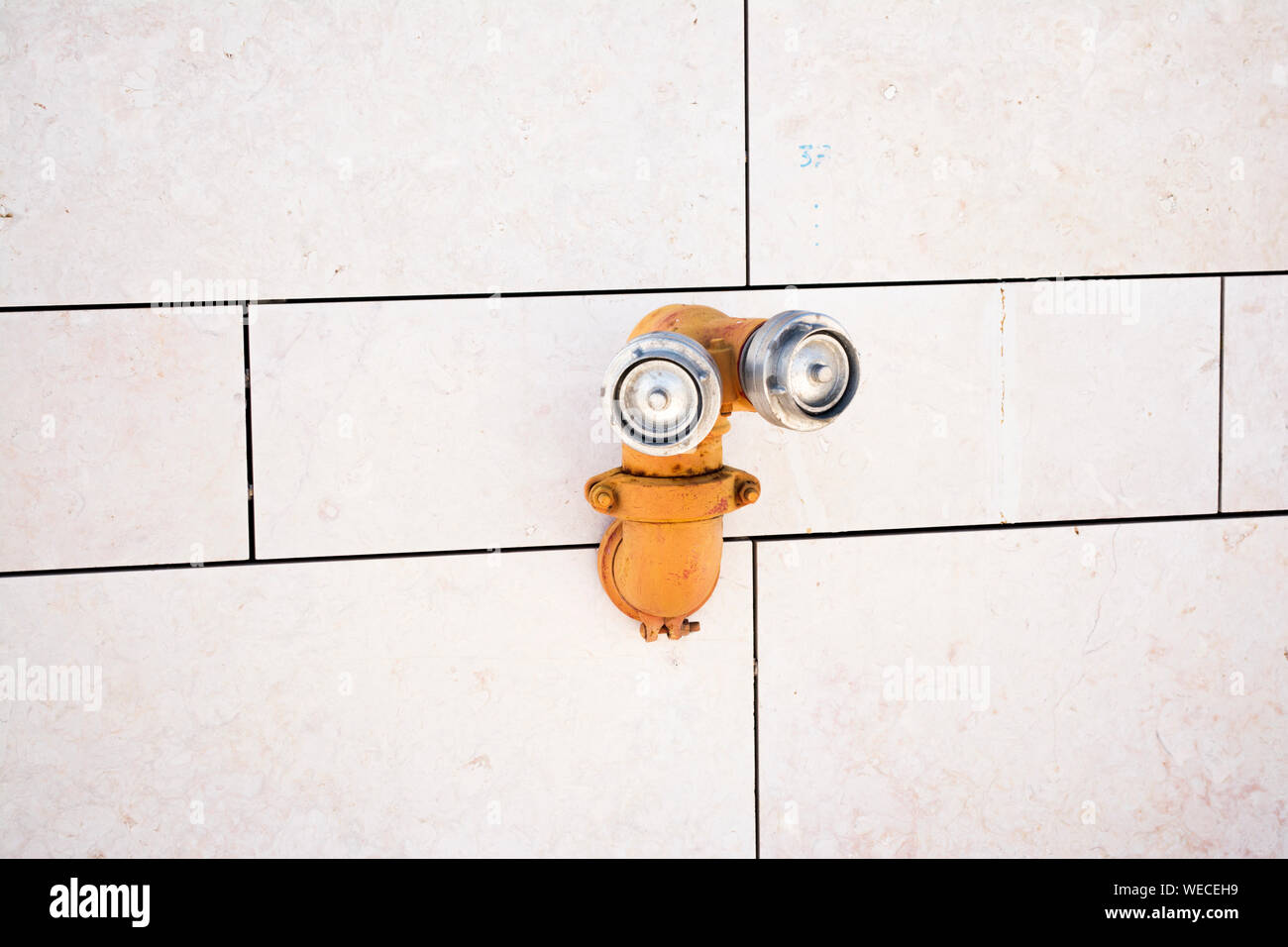 Fire Hydrant On Wall High Resolution Stock Photography and Images - Alamy