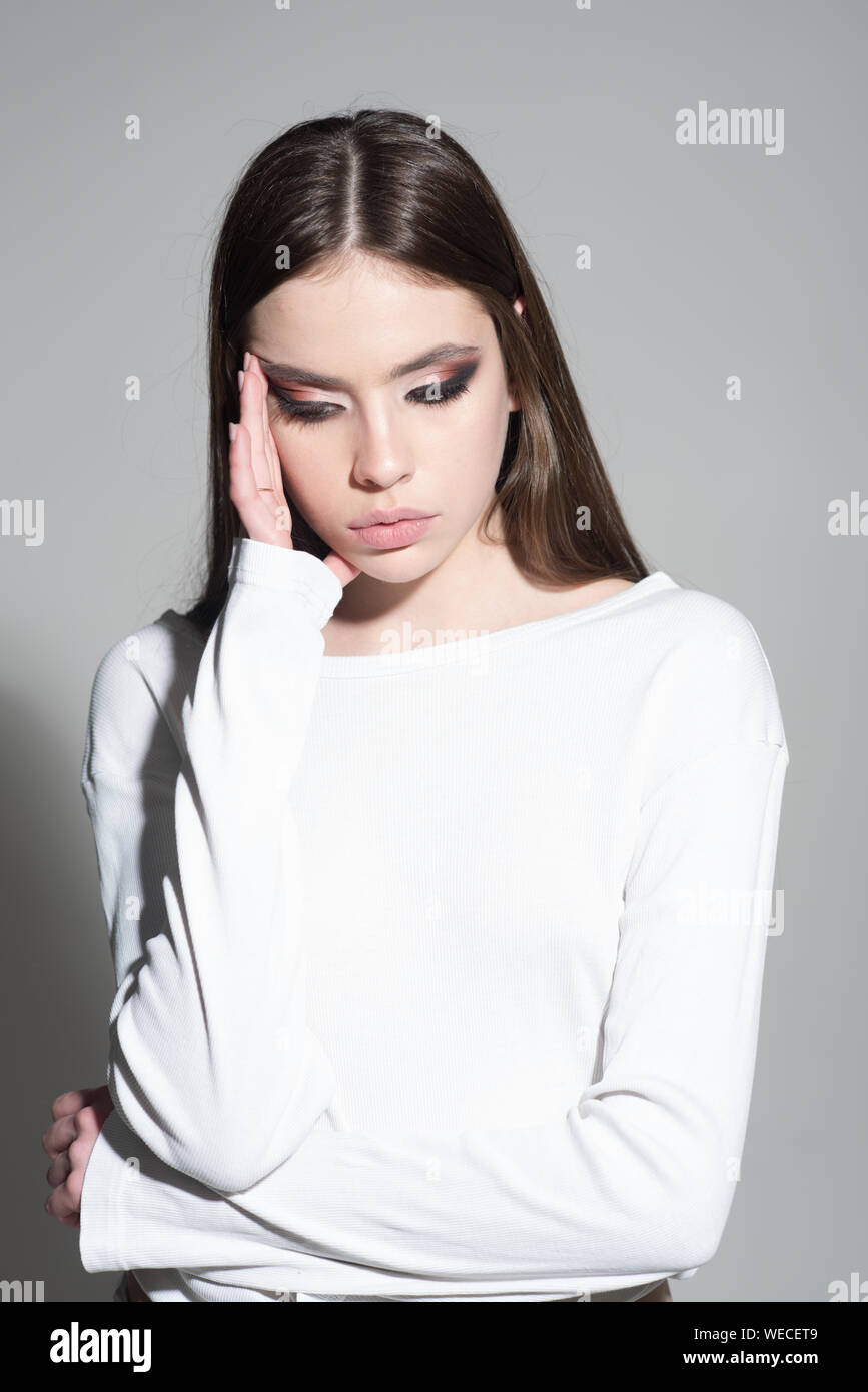 Feeling stressed. Trendy woman with stylish hair and fashionable makeup ...