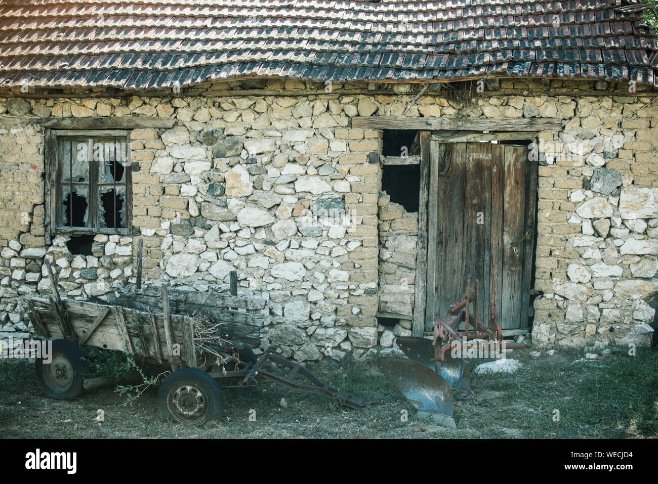 Ruins of abandoned farm building. Old barn ruins. Stone house in decay ...