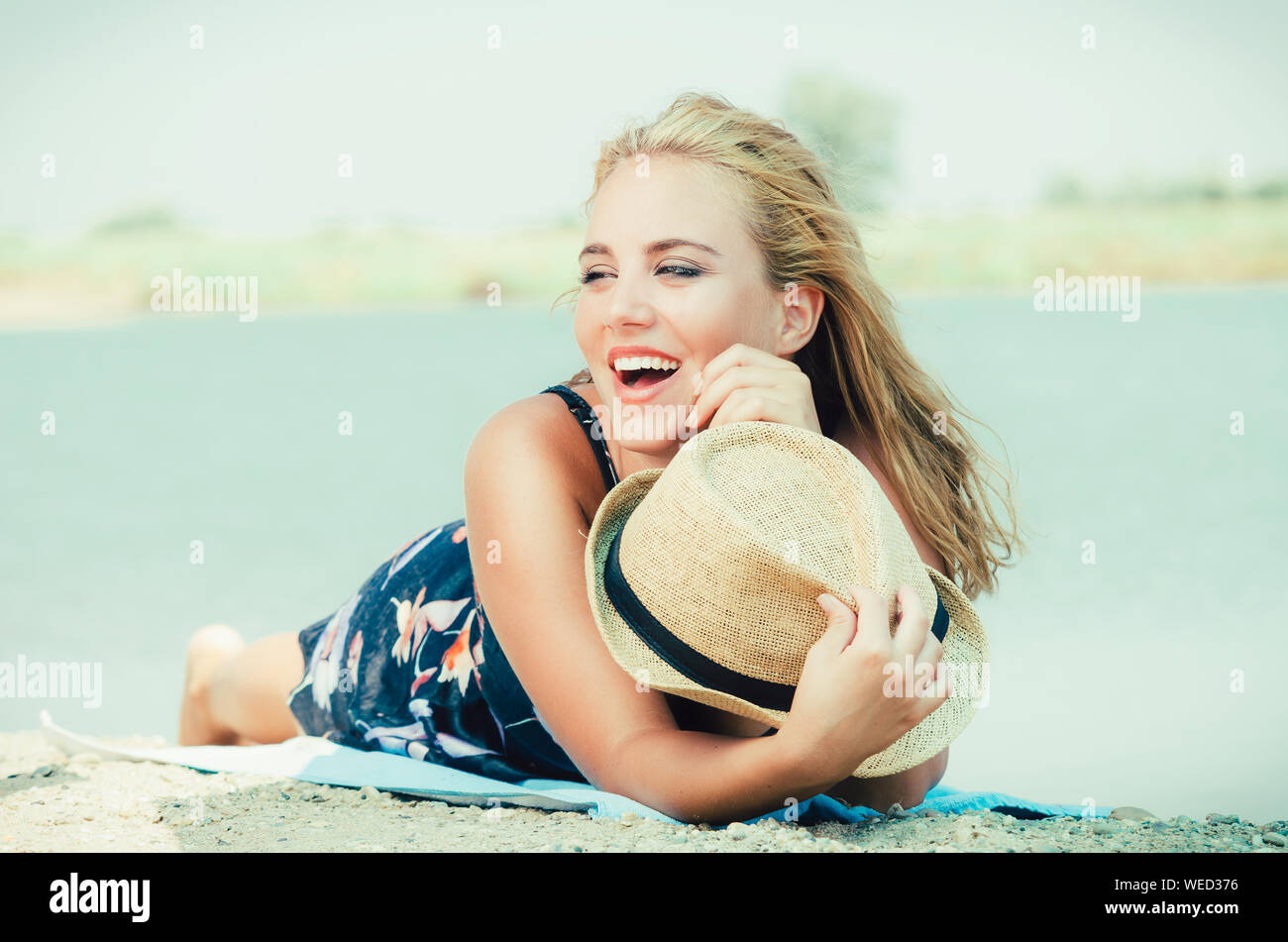 Woman lying beach hi-res stock photography and images - Alamy