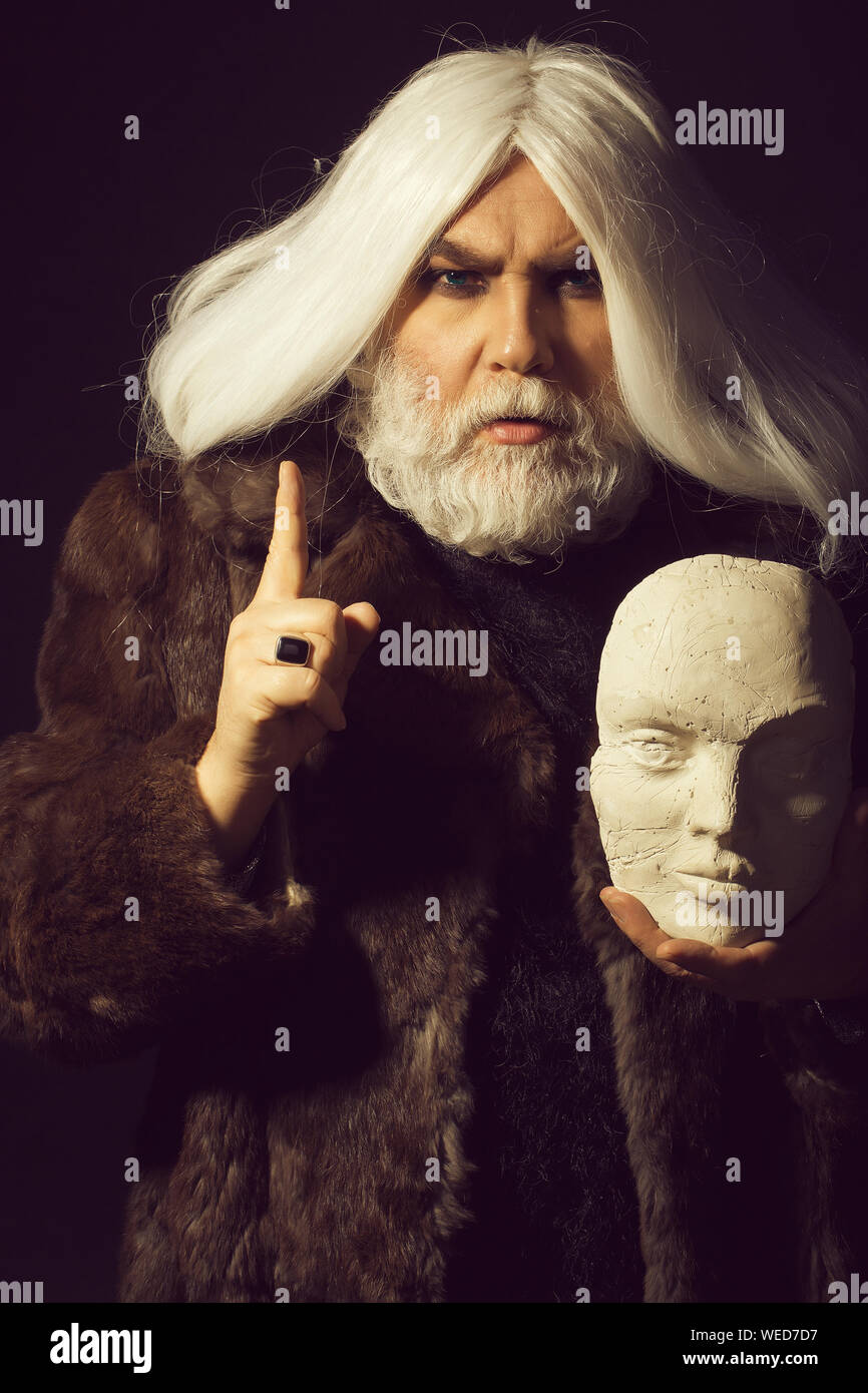 bearded man with sculpture head Stock Photo - Alamy