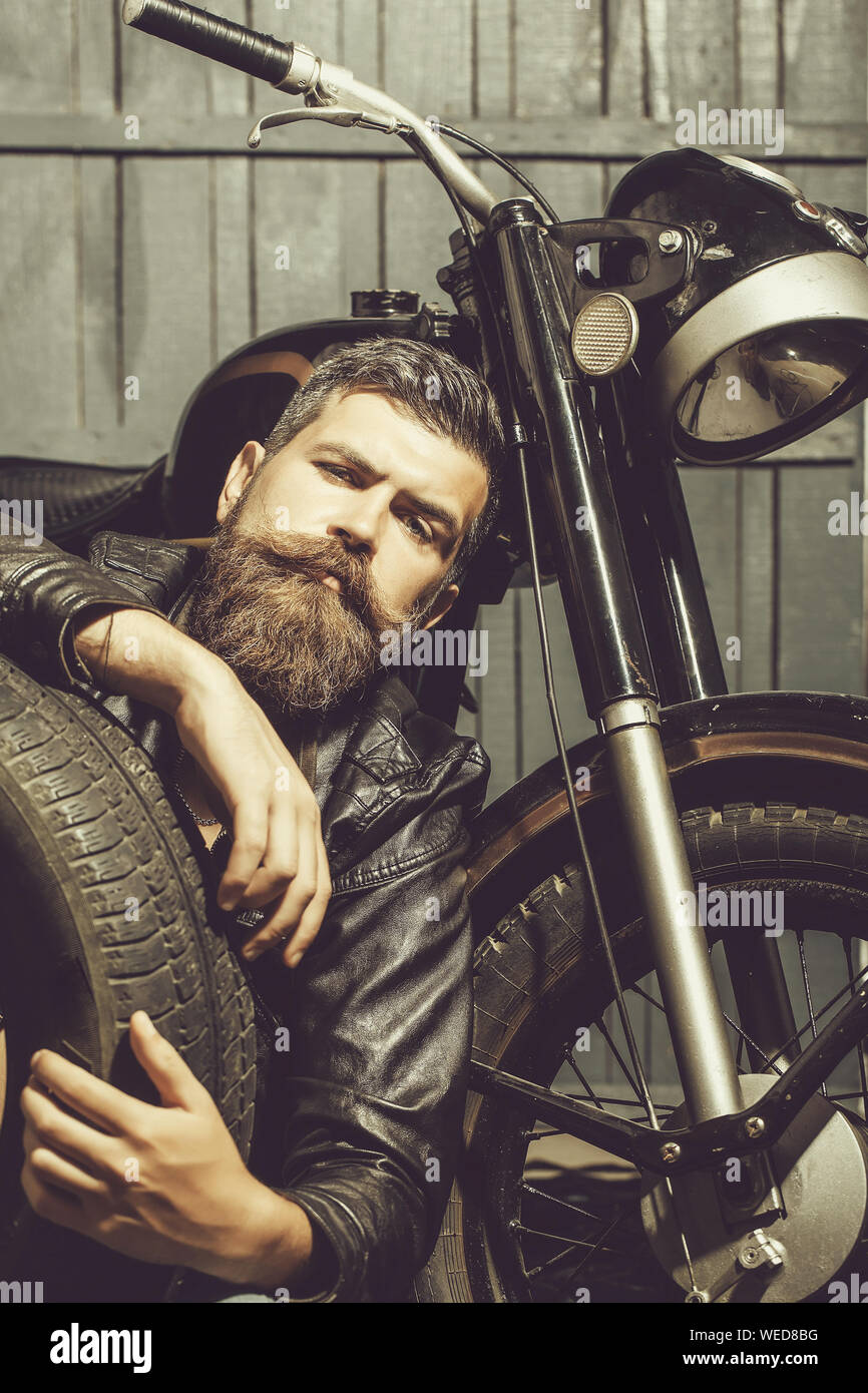 Bearded man hipster biker Stock Photo - Alamy