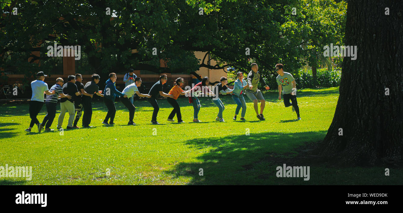 Melbourne, Australia, group of friends playing a game and having fun ...