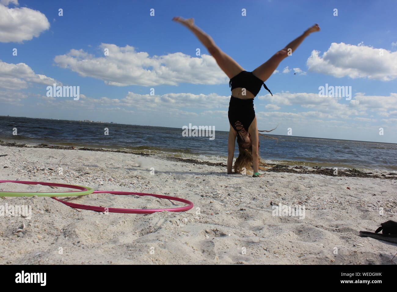 Woman handstand beach sand hi-res stock photography and images - Alamy