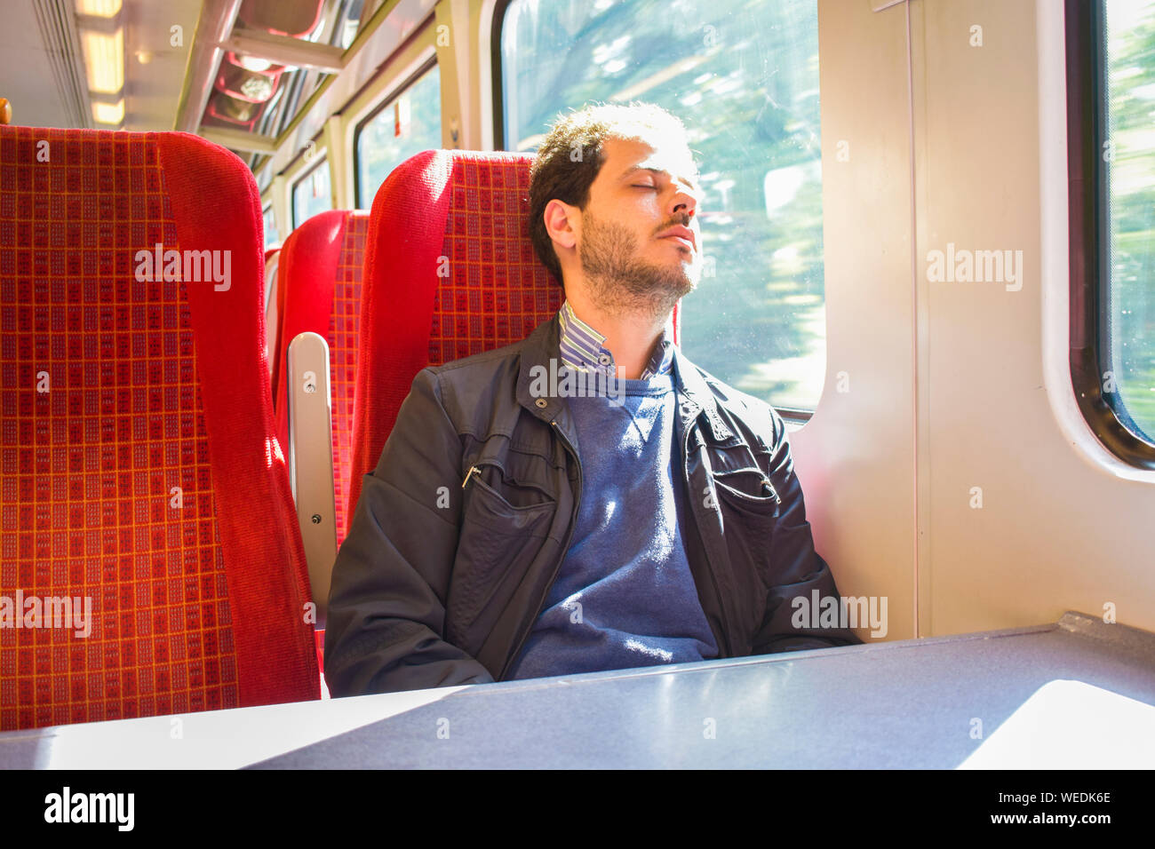 Man Sleeping On Train High Resolution Stock Photography and Images - Alamy